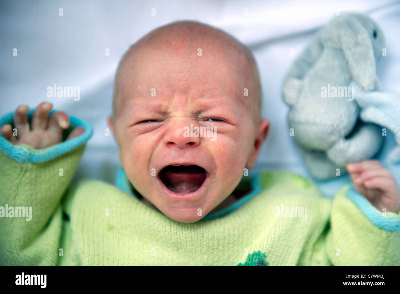 A crying new born baby Stock Photo - Alamy