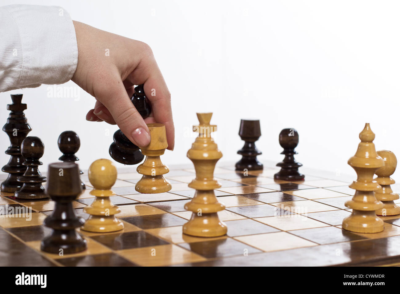 Human hand move chess figure at chessboard Stock Photo - Alamy