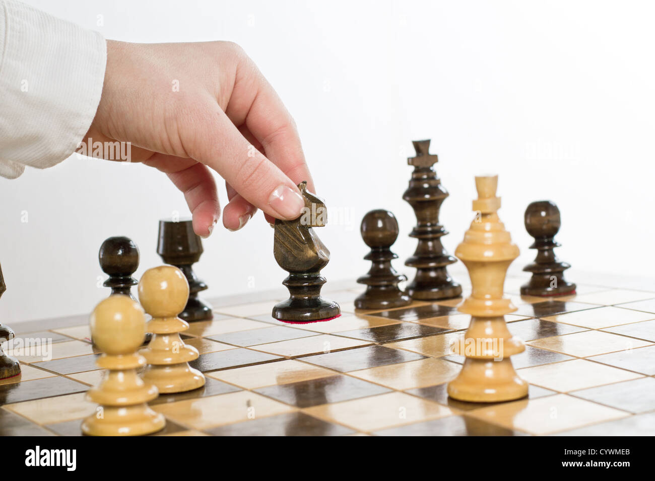 Human hand move chess figure at chessboard Stock Photo - Alamy