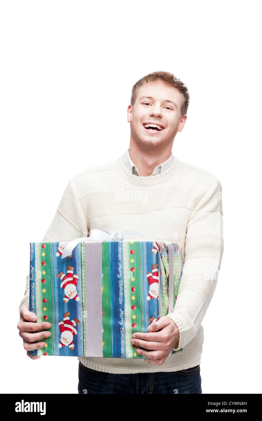 young happy man holding big heavy gift Stock Photo - Alamy