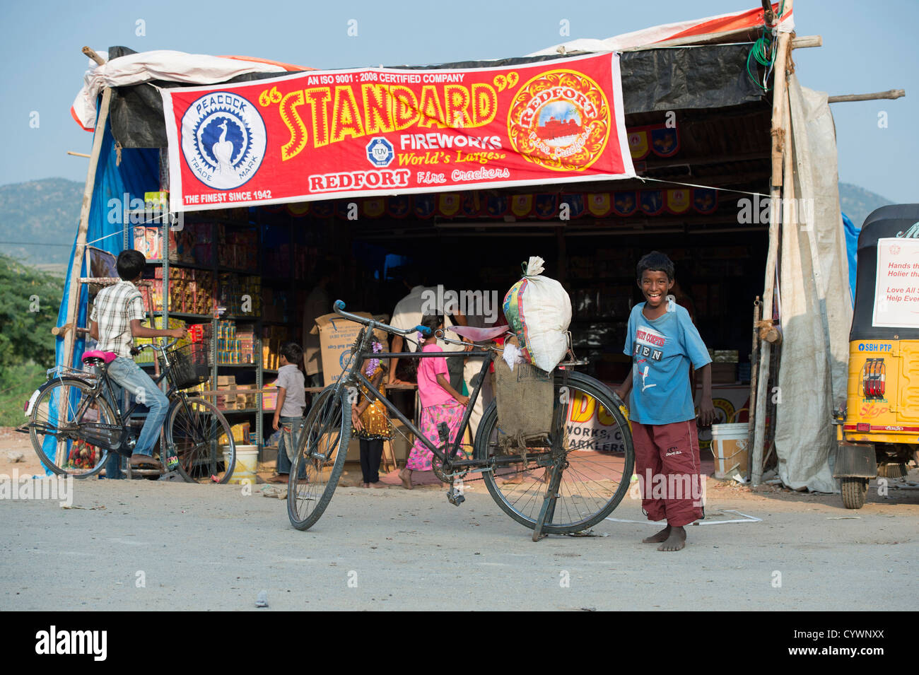 Indian children next to a temporary Indian firework shop at Diwali ...