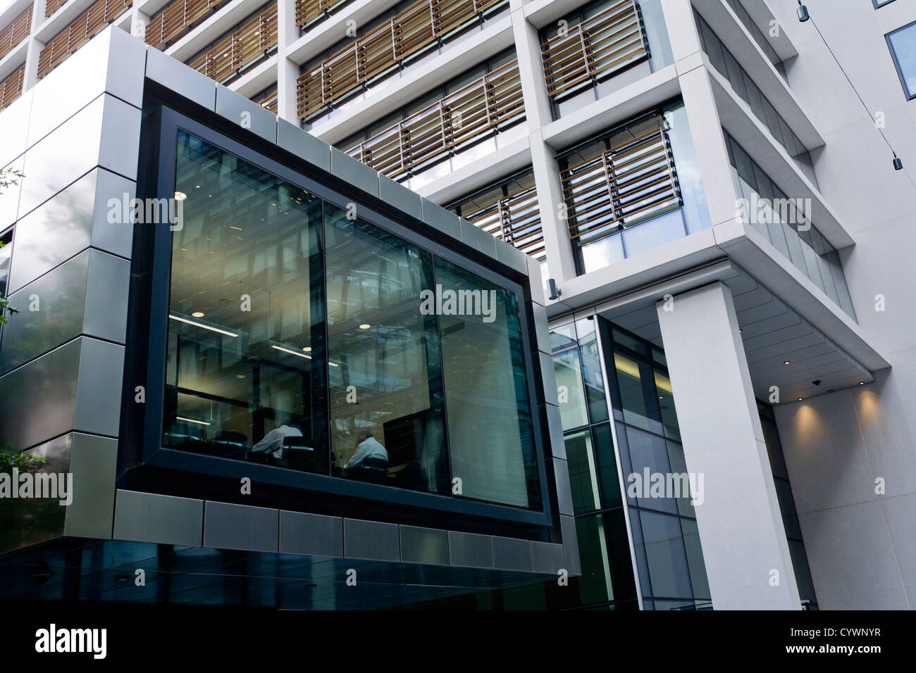 Men at work into a new glass iron buildings in the City district in ...