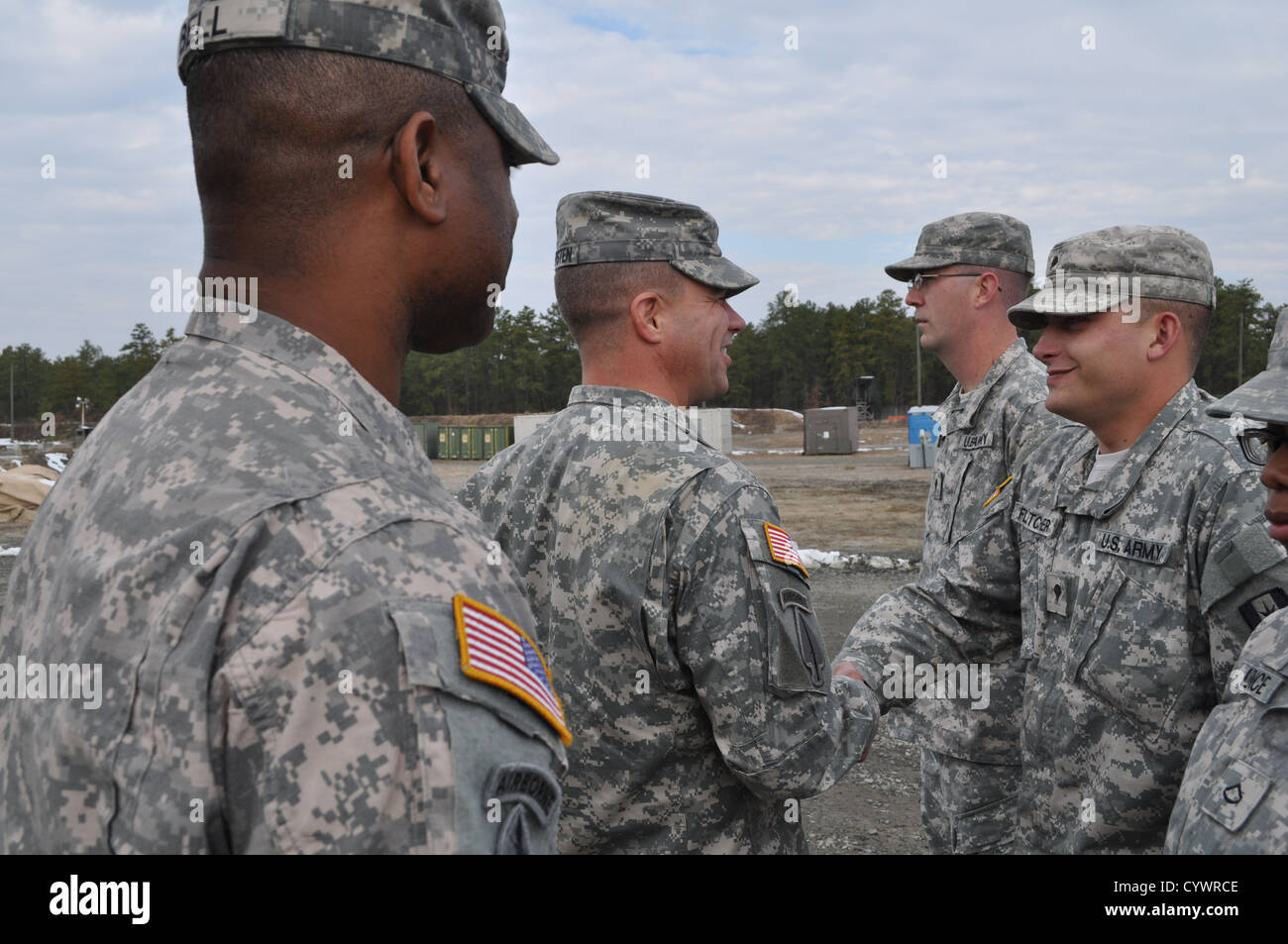 Col. Chris Sharpsten of the 82nd Sustainment Brigade addresses a ...