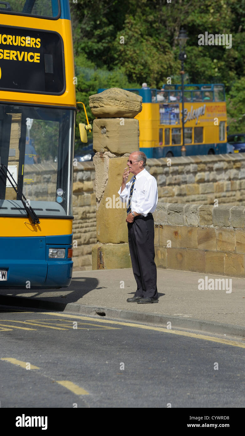 bus driver smoking whilst taking a break Scarborough england uk Stock ...