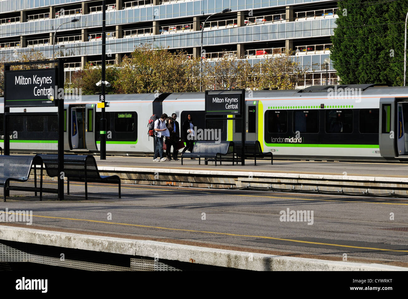 Passengers walking along the platform at Milton Keynes Central train ...
