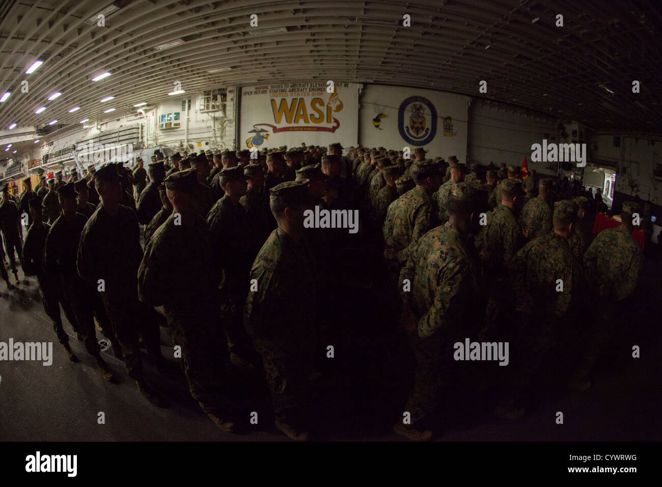 Marines and Sailors from the 26th MEU aboard USS Wasp watch the ...