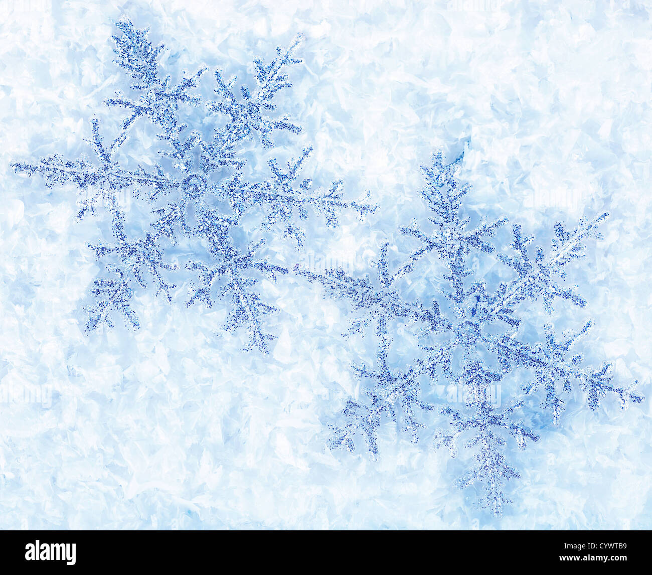 Beautiful blue snowflakes isolated on snow, winter holiday background ...