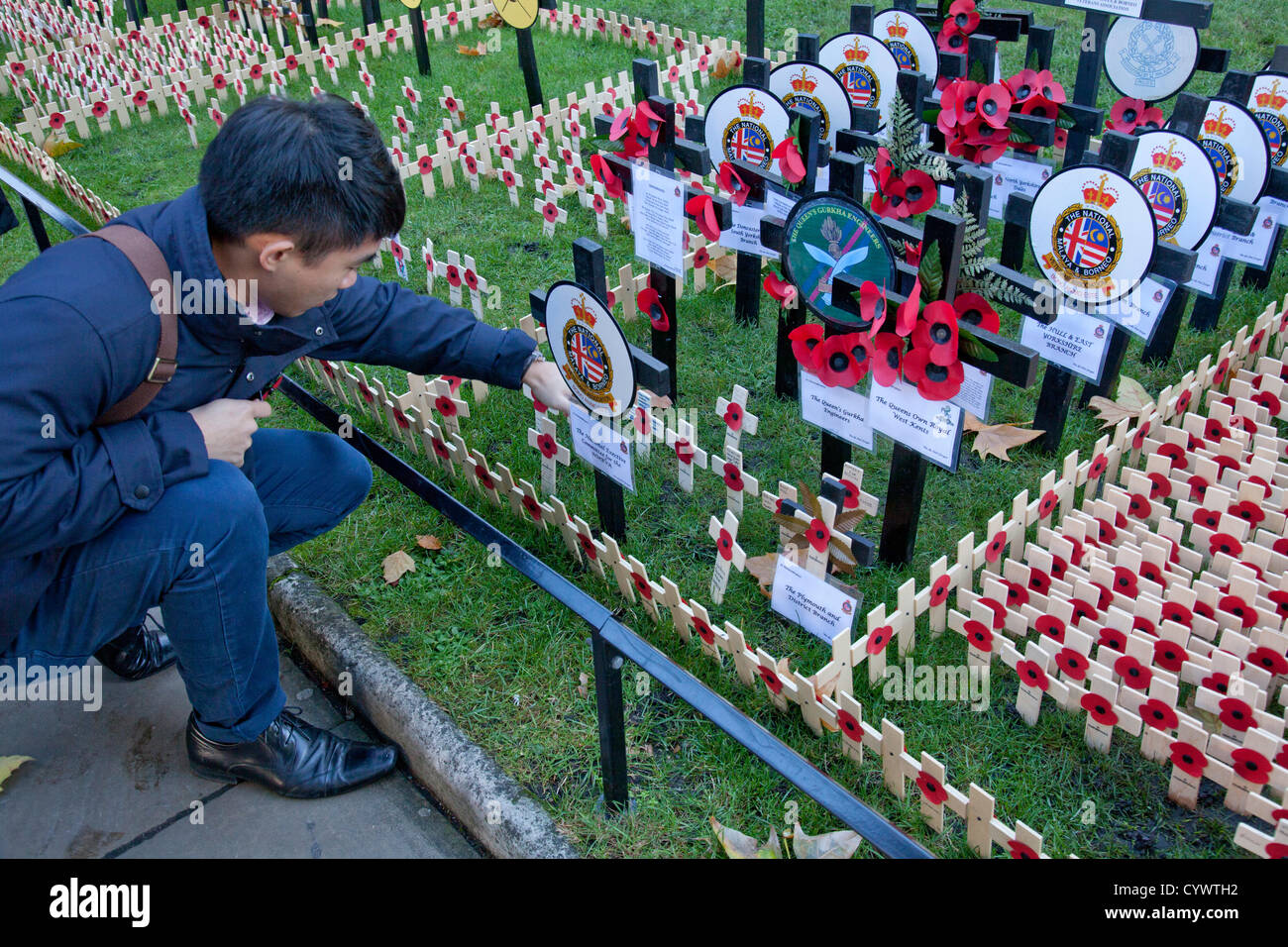People pay respect to their dead relatives and friends during ...