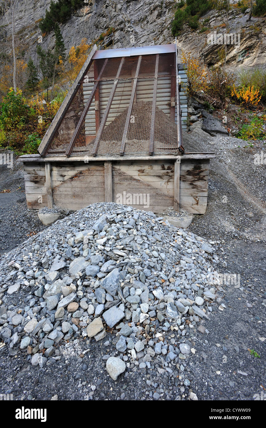 A roadside sieve, or screen, for sorting gravel to use on mountain ...