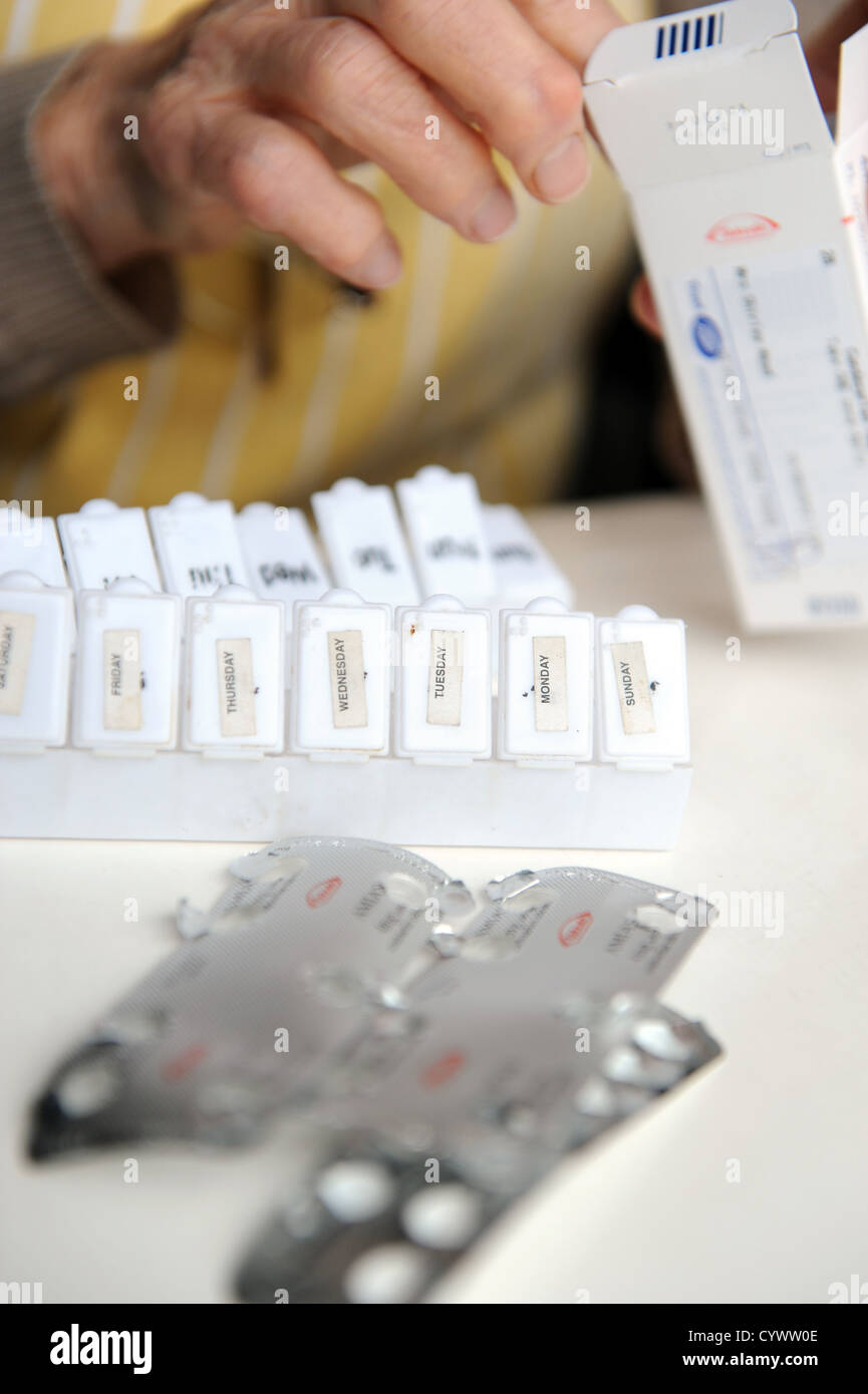 Elderly lady pill box hi-res stock photography and images - Alamy