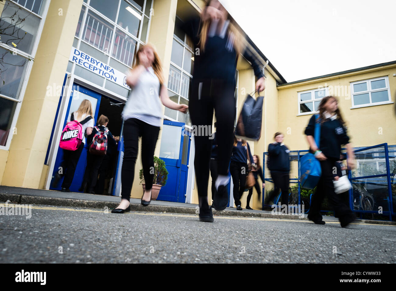 At the end of the day teenage pupils rushing out leaving a secondary ...