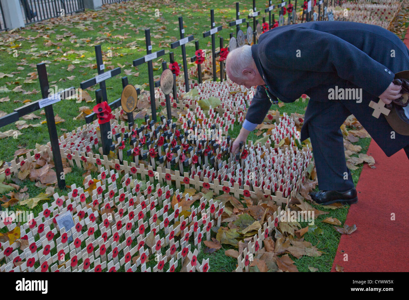 Elderly man pays respect to their dead relatives and friends during ...