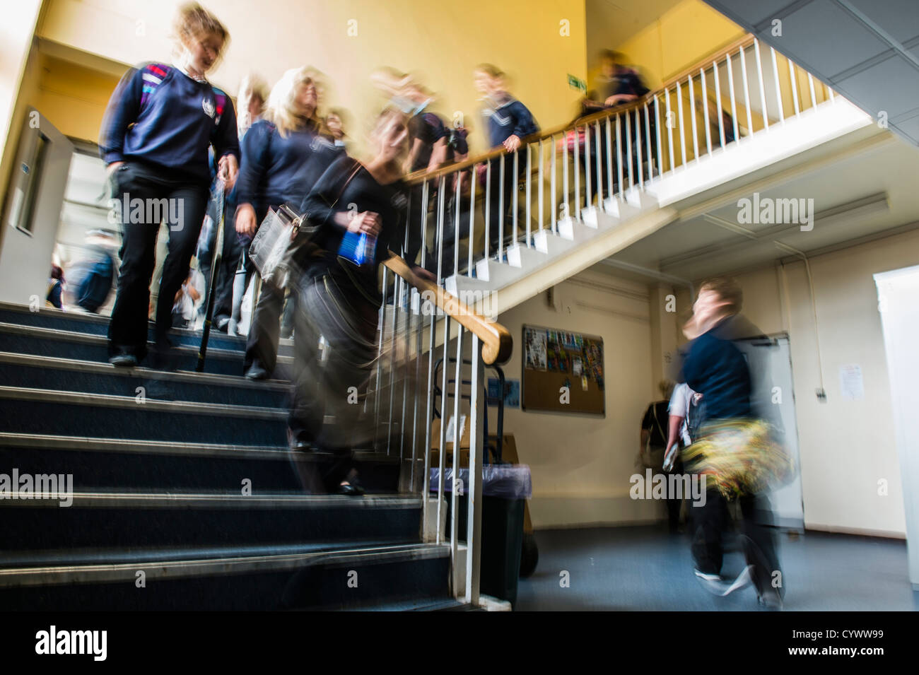 Blurred school pupils in the corridor rushing to their next class in ...