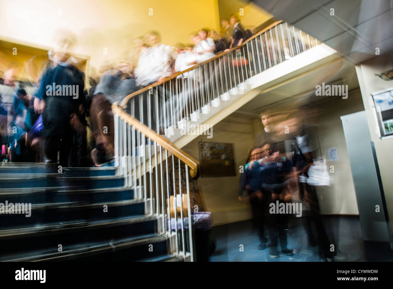 Blurred pupils in the corridor of a secondary school, Wales UK Stock ...