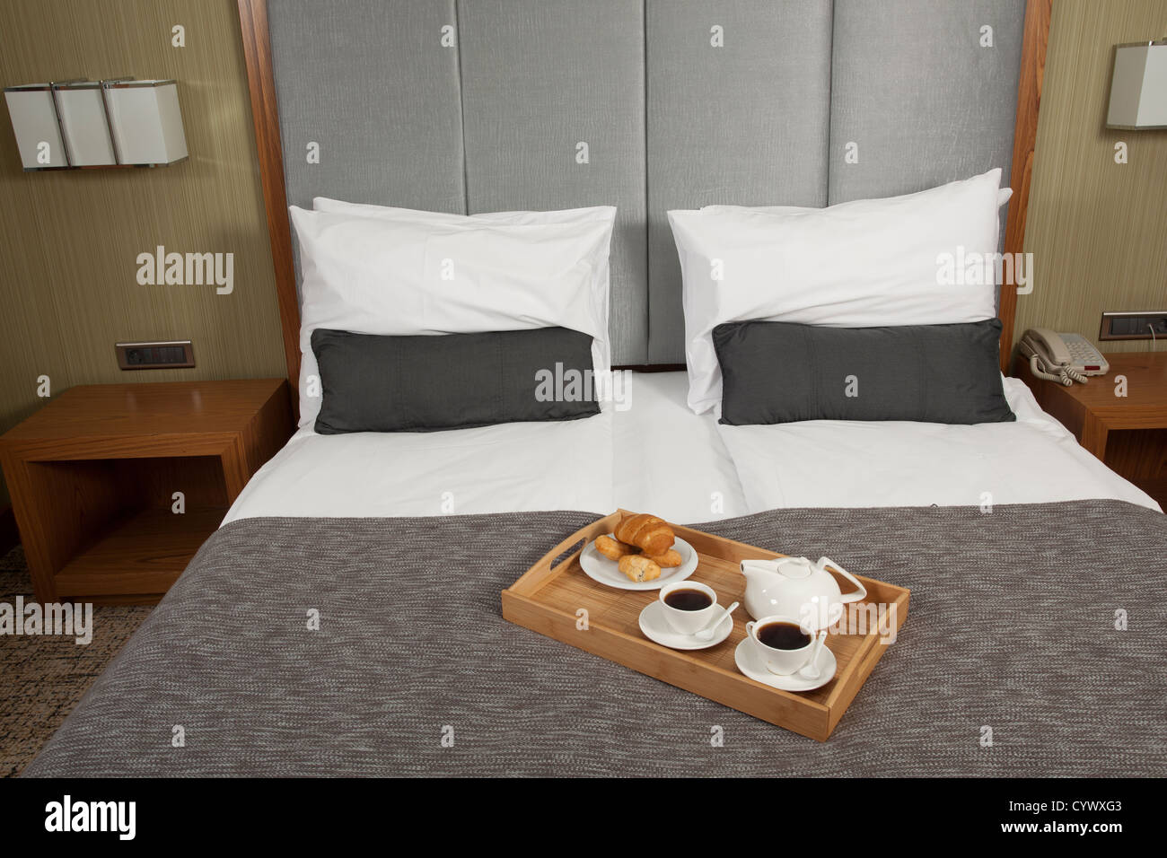 Tray with coffee on a bed in a hotel room Stock Photo - Alamy