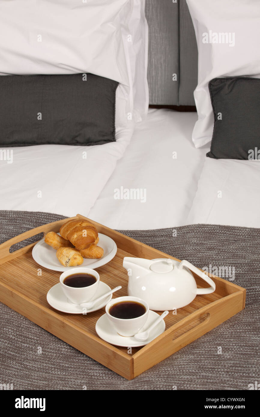 Tray with coffee on a bed in a hotel room Stock Photo - Alamy