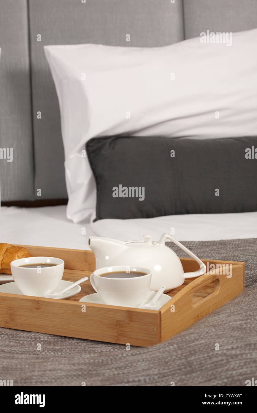 Tray with coffee on a bed in a hotel room Stock Photo - Alamy