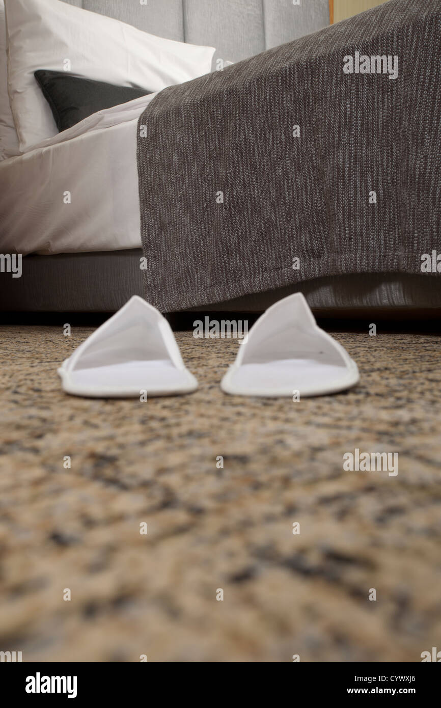 Slippers on the floor of hotel room Stock Photo - Alamy