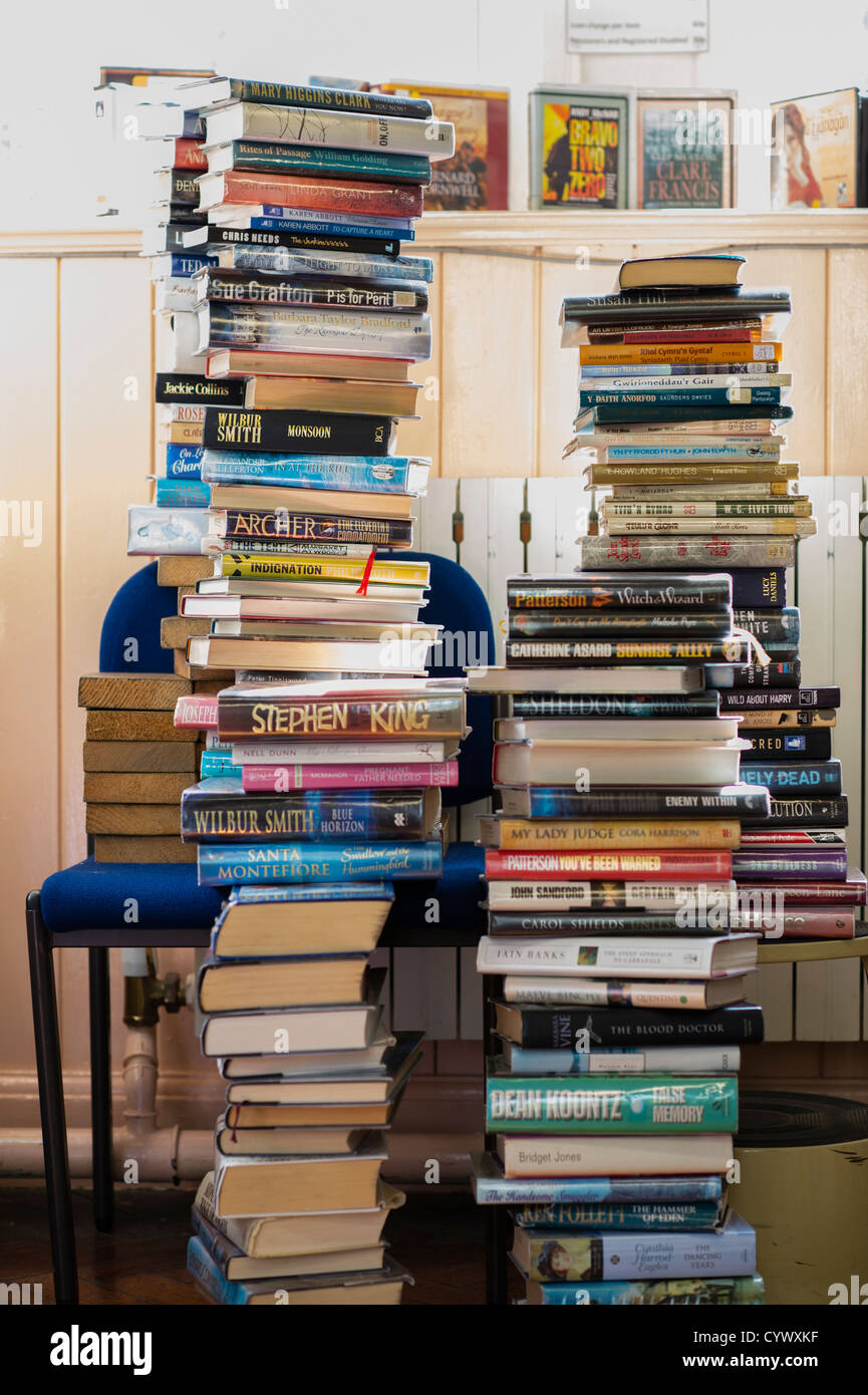 A stack of textbooks and novels in the library of a secondary ...