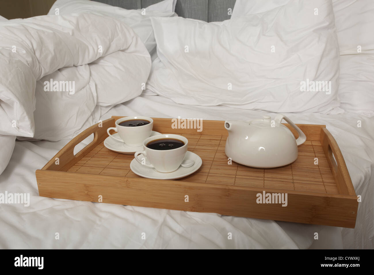 Tray with coffee on a bed in a hotel room Stock Photo - Alamy