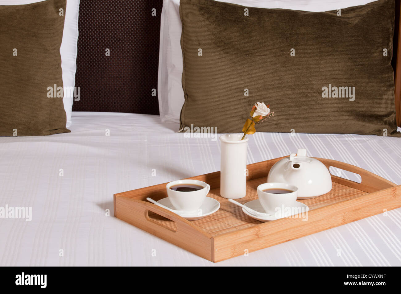 Tray with coffee on a bed in a hotel room Stock Photo - Alamy