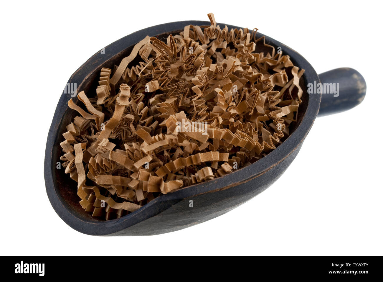 shredded brown packing paper on a rustic wooden scoop isolated on white ...