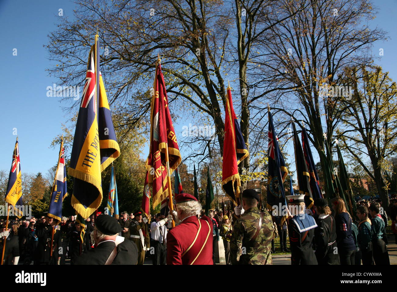 veterans holding flags including the flag of the royal british legion ...