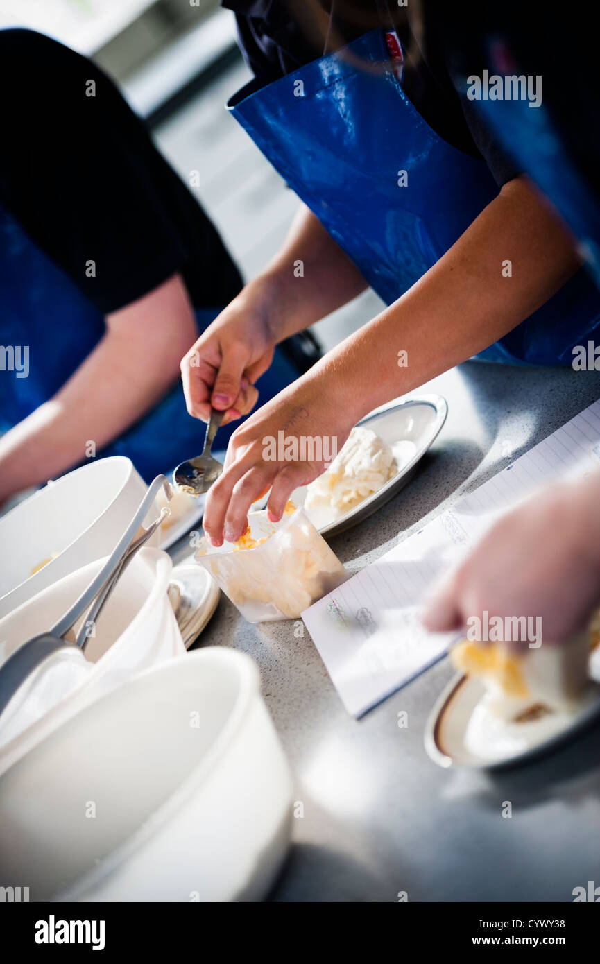 A girl in a cookery food technology class in a secondary comprehensive ...
