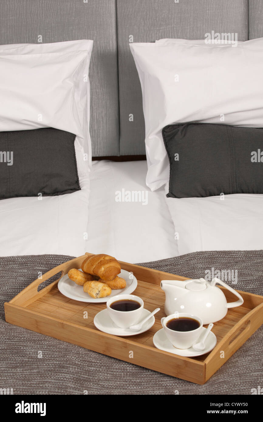 Tray with coffee on a bed in a hotel room Stock Photo - Alamy