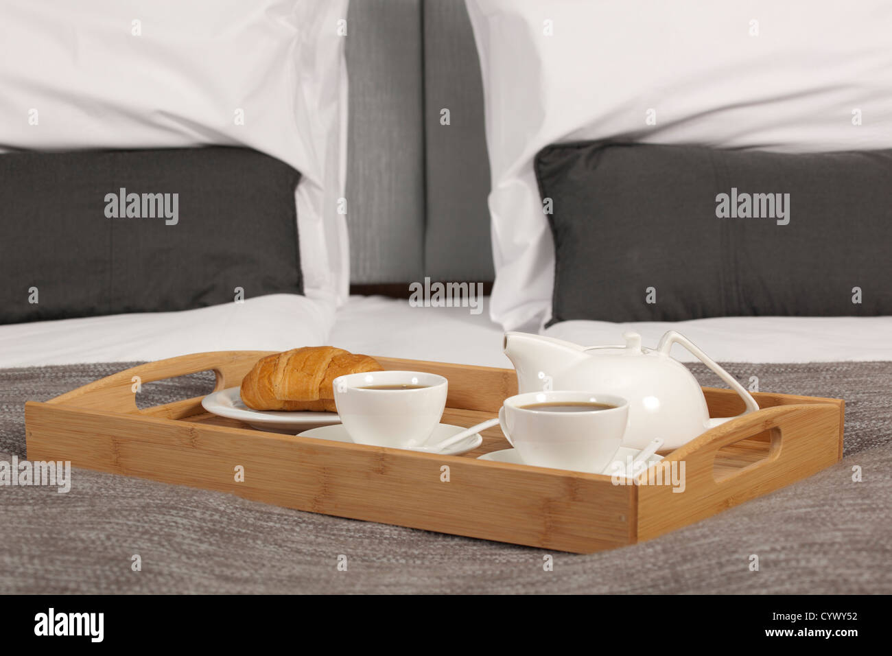 Tray with coffee on a bed in a hotel room Stock Photo - Alamy