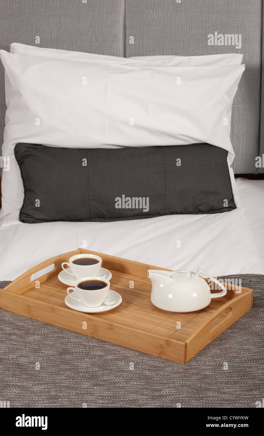 Tray with coffee on a bed in a hotel room Stock Photo - Alamy