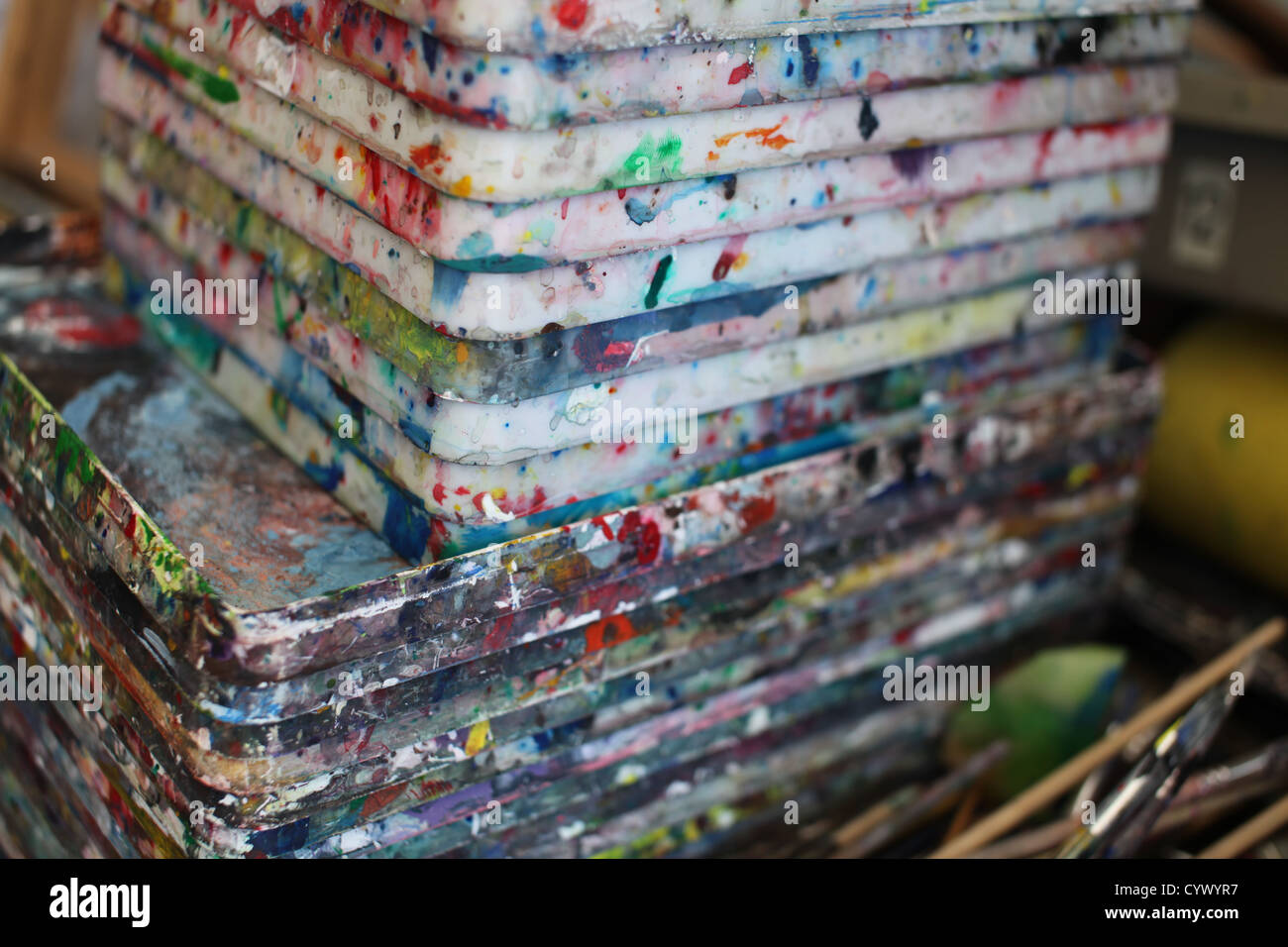 Messy colourful paint materials Stock Photo - Alamy