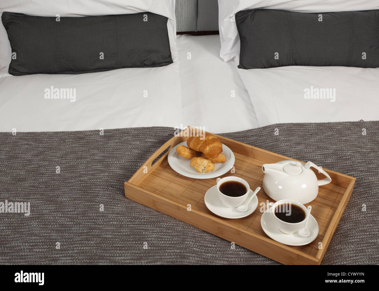 Tray with coffee on a bed in a hotel room Stock Photo - Alamy