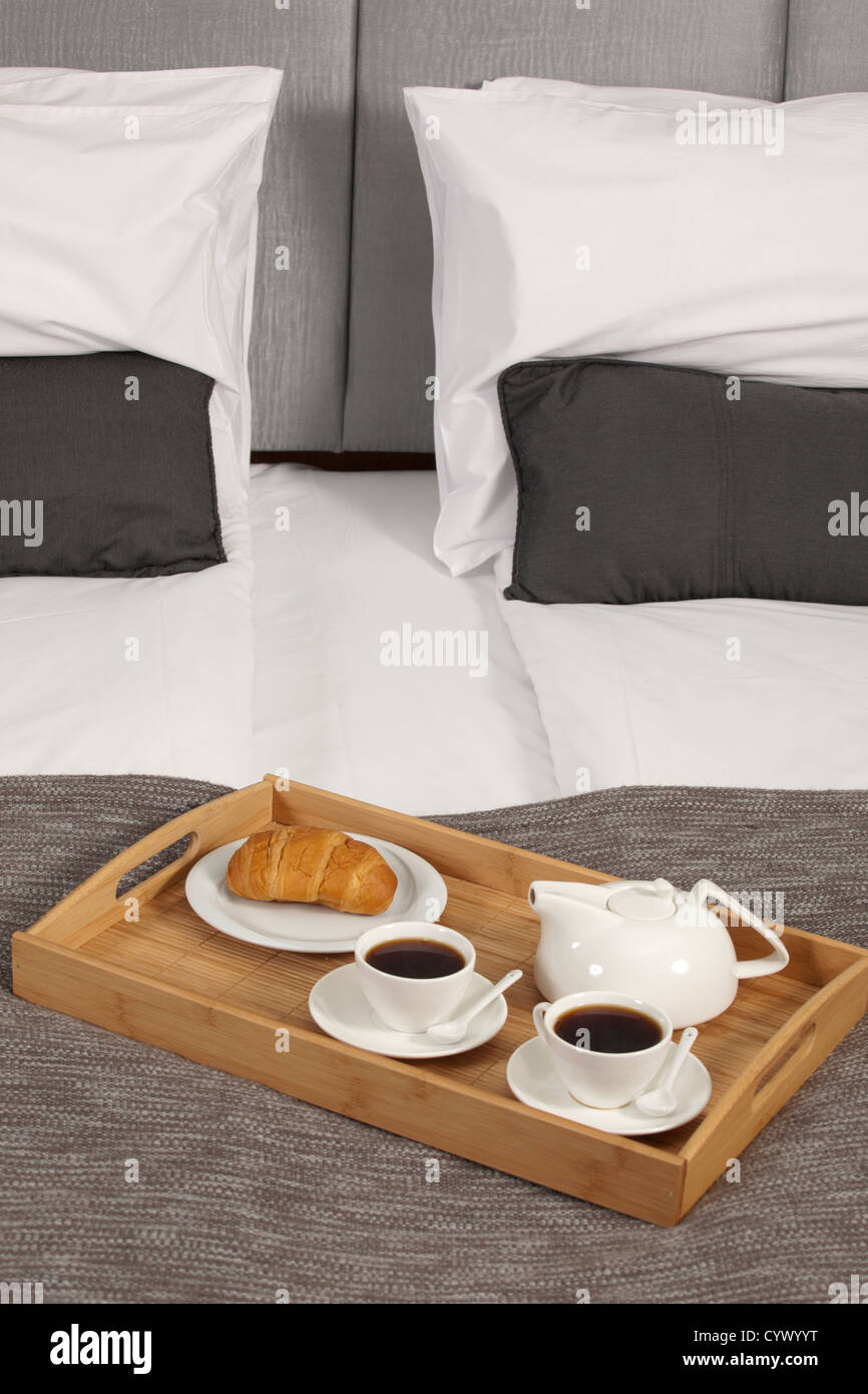Tray with coffee on a bed in a hotel room Stock Photo - Alamy