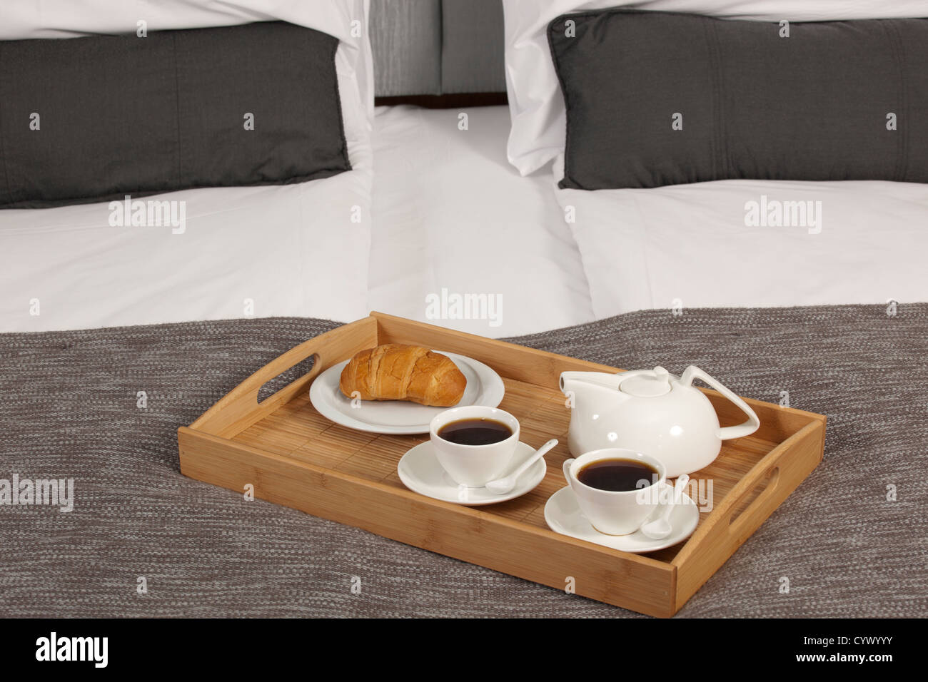 Tray with coffee on a bed in a hotel room Stock Photo - Alamy