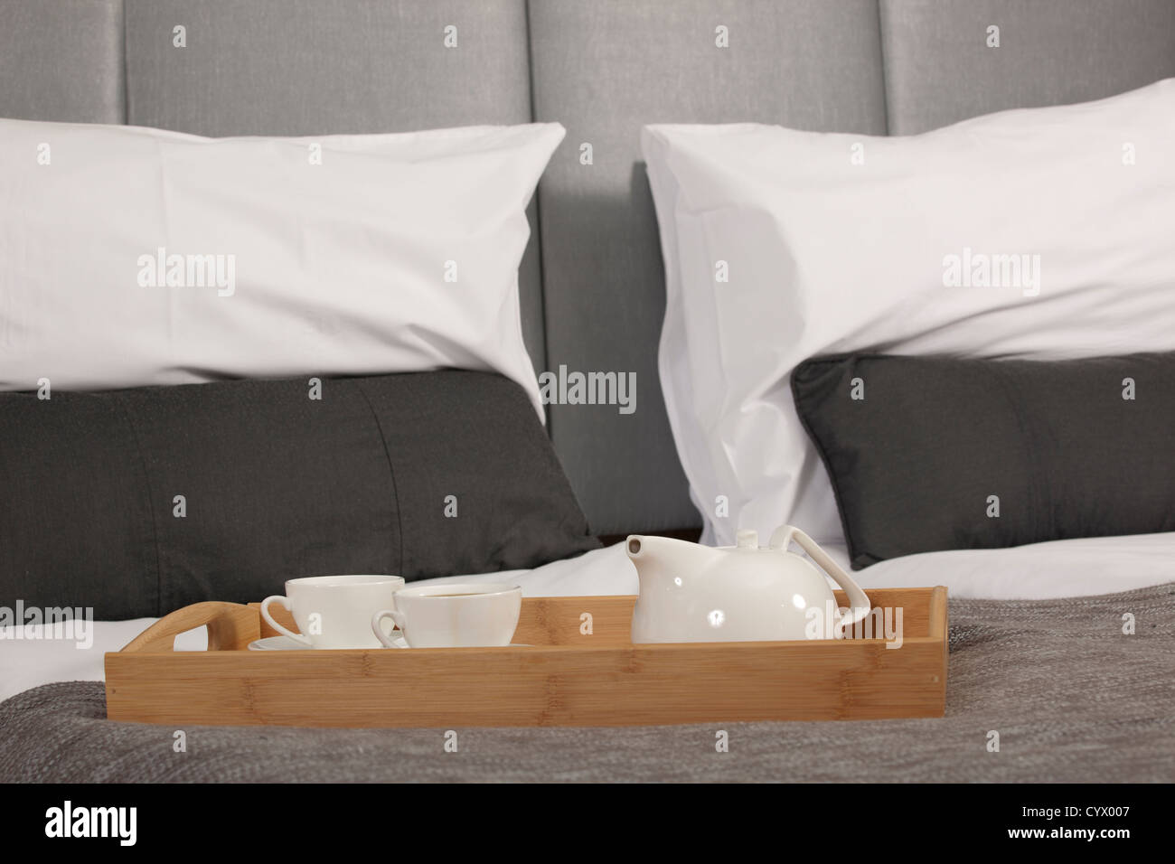 Tray with coffee on a bed in a hotel room Stock Photo - Alamy