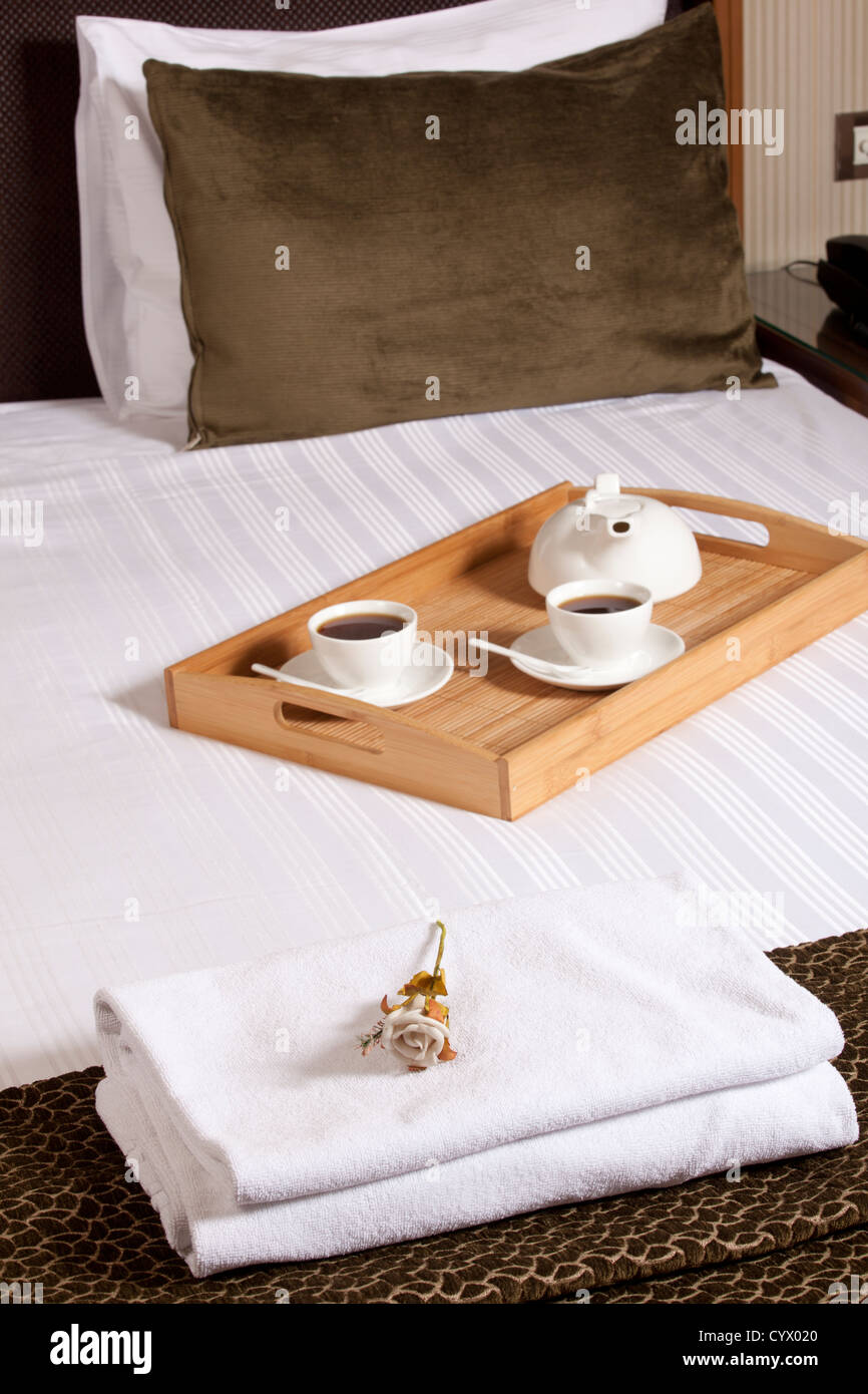 Tray with coffee on a bed in a hotel room Stock Photo - Alamy