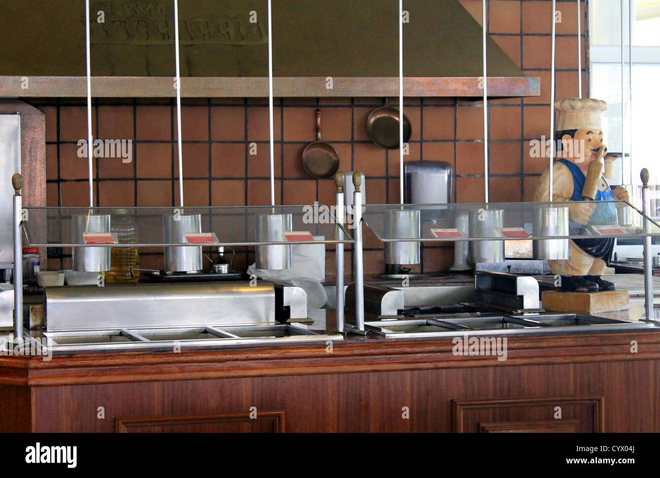 Interior of modern commercial kitchen with chef figure Stock Photo - Alamy