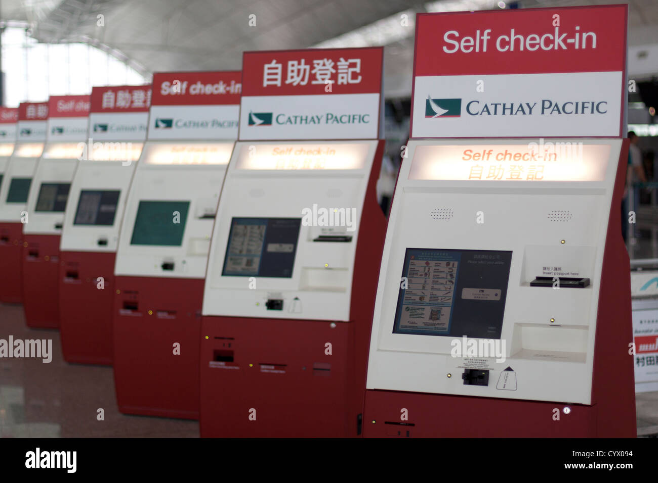 Cathay Pacific self check-in kiosks with focus on English Stock Photo ...