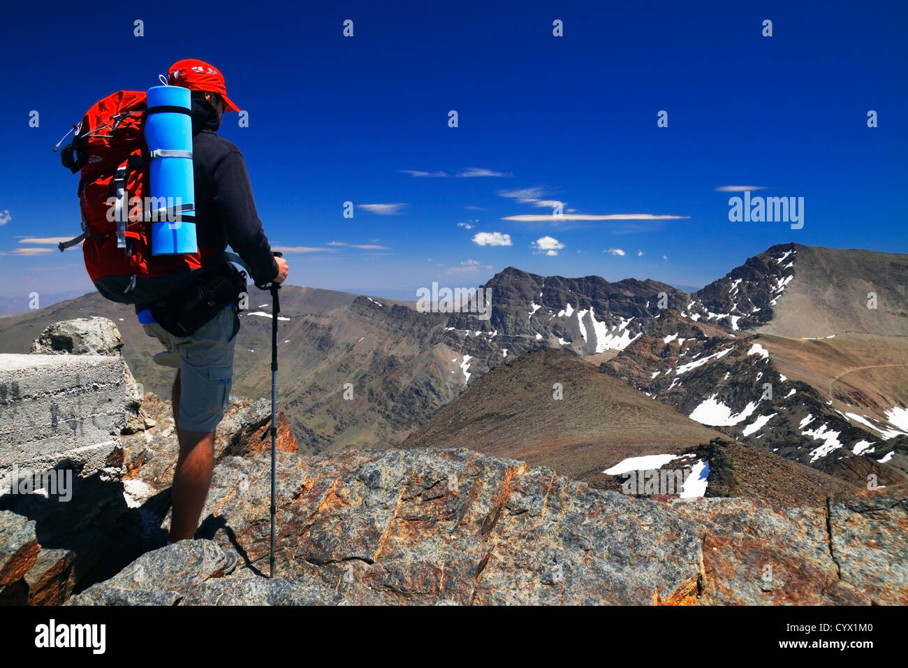 Climber on top on Mount Veleta facing Mount Mulhacen, the highest ...