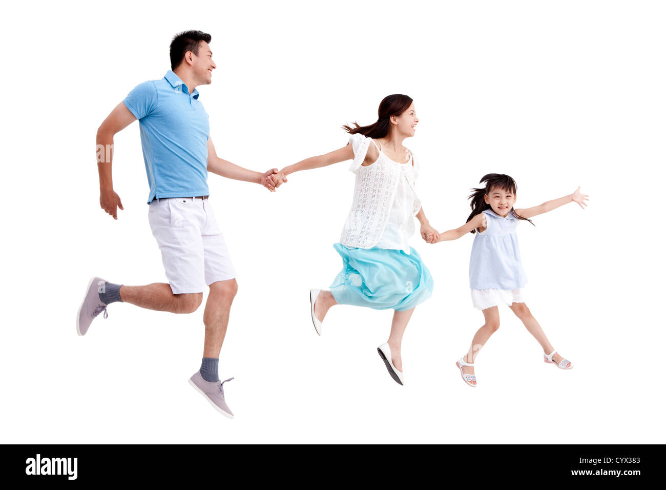 Excited family jumping, hand in hand Stock Photo - Alamy