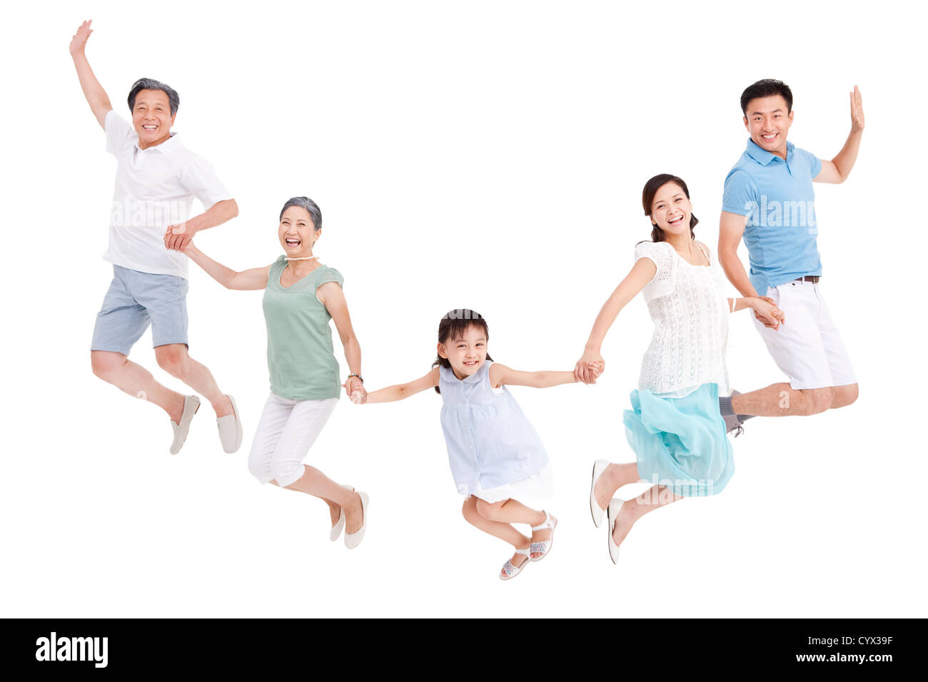 Excited family jumping, hand in hand Stock Photo - Alamy