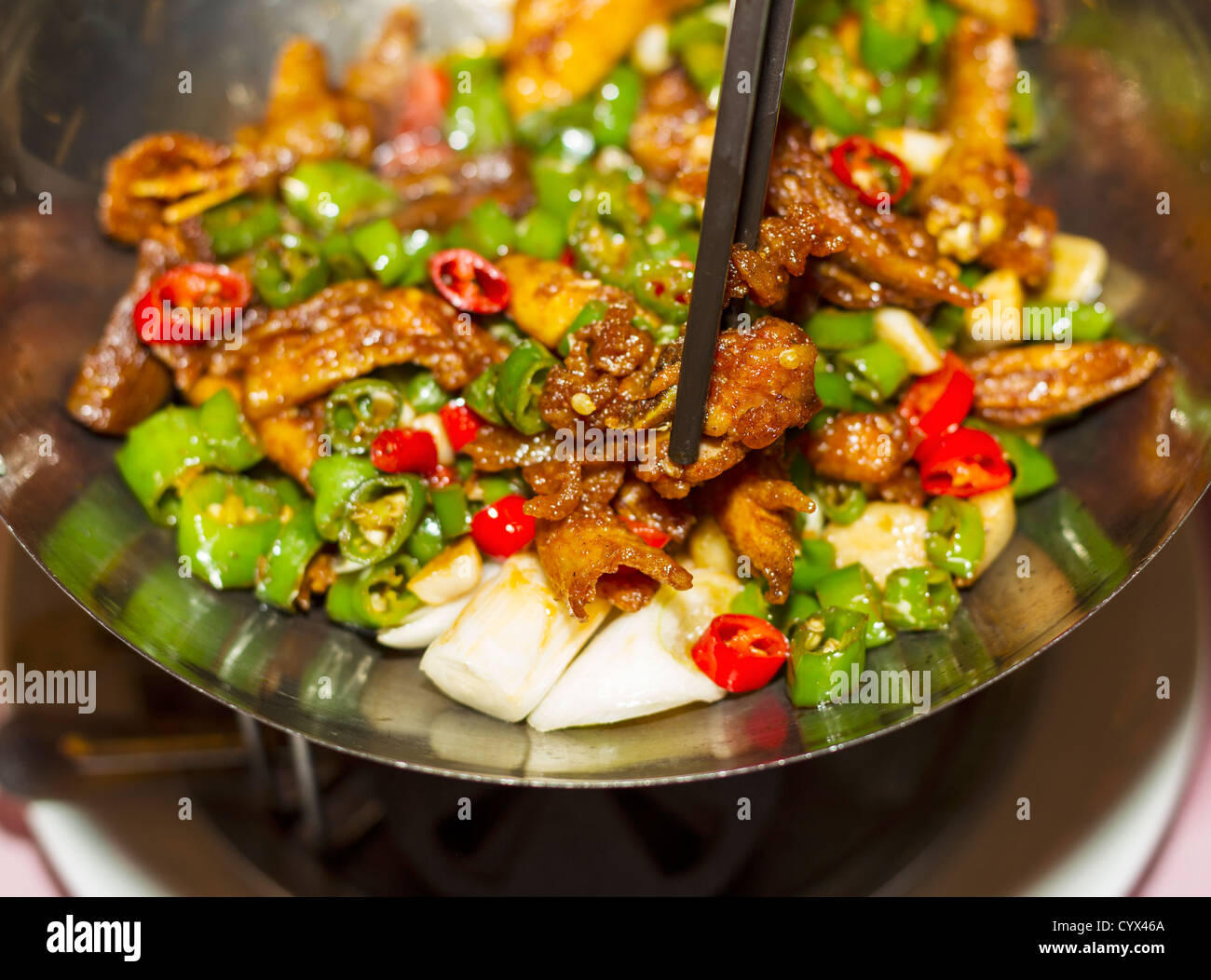 Spicy hot Chinese dish made in China with chop sticks in pan Stock ...