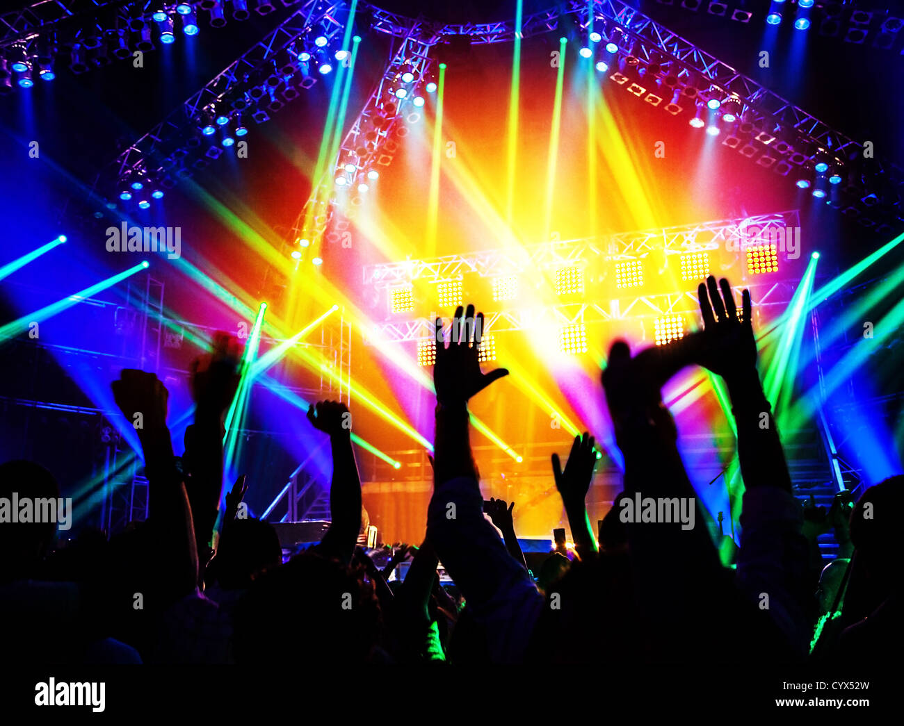 Rock concert, happy people silhouettes, raise up hands, disco party ...