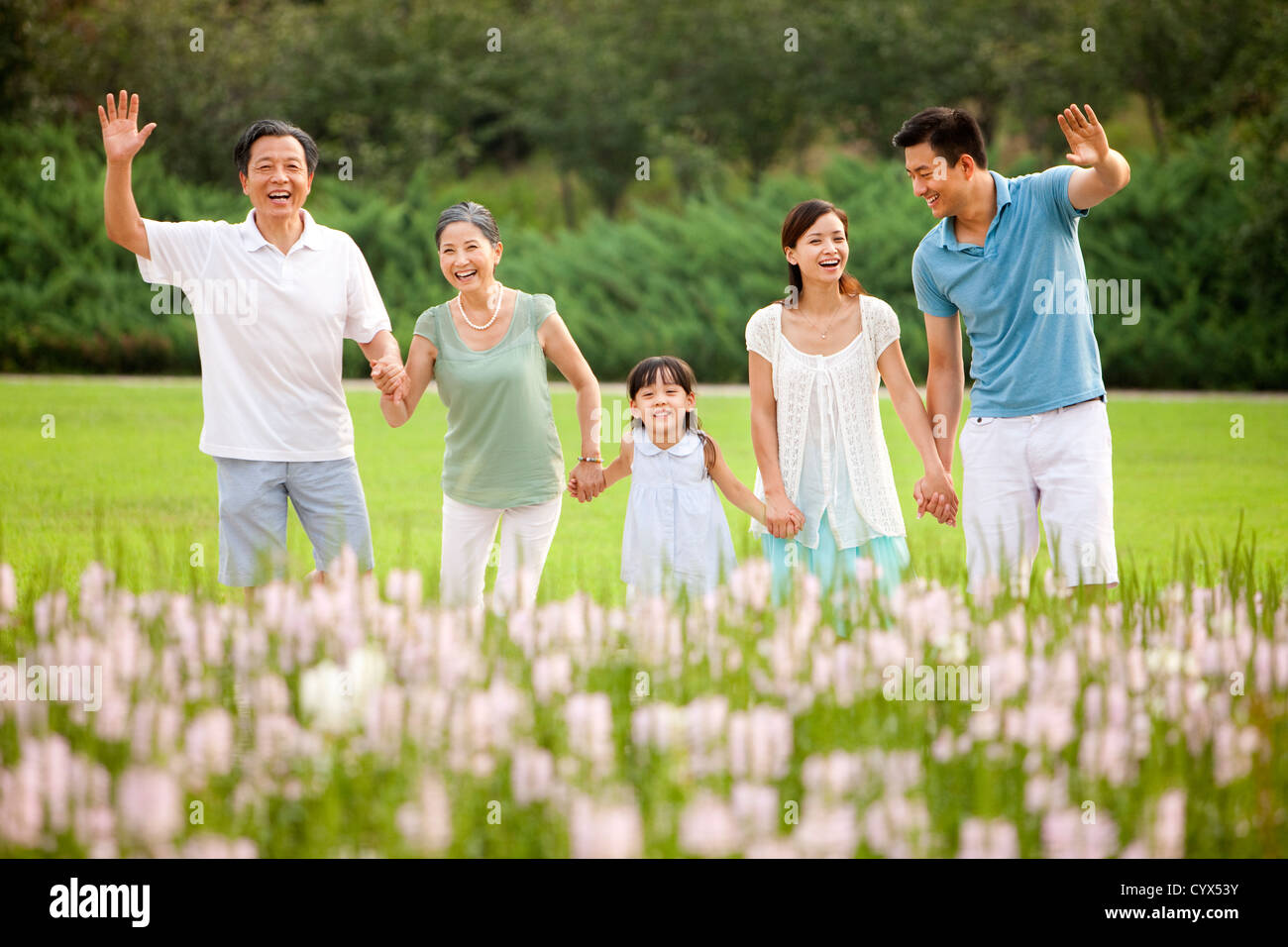Happy family enjoying themselves outdoors Stock Photo - Alamy