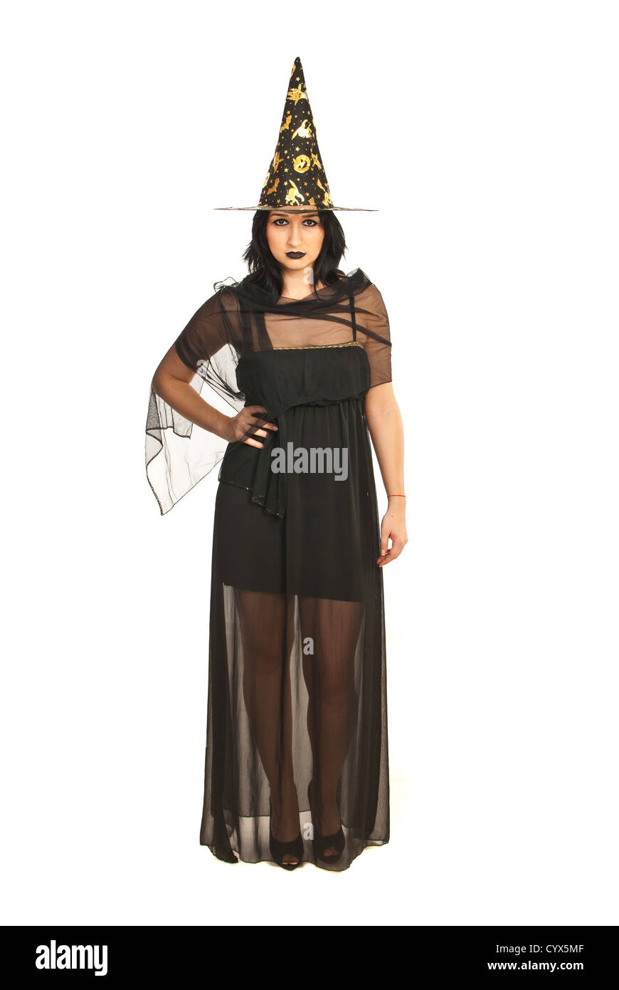 Full length of elegant witch posing isolated on white background Stock ...