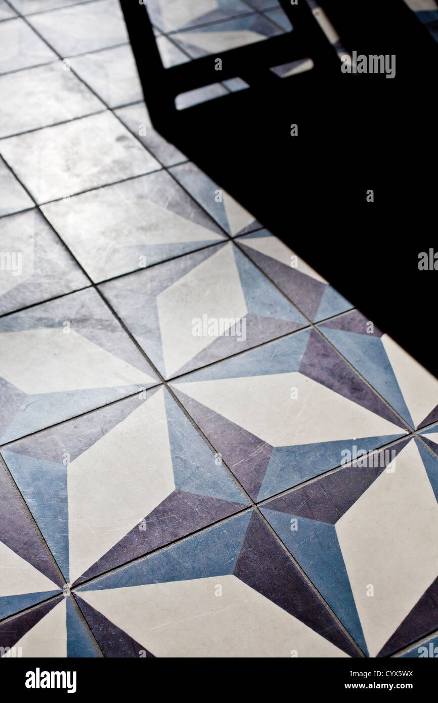 Kitchen floor with handpainted floor tiles Stock Photo - Alamy