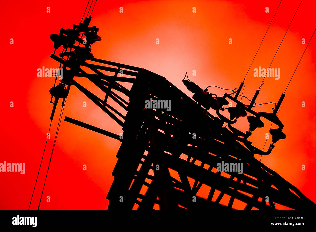 Power line on red background Stock Photo - Alamy