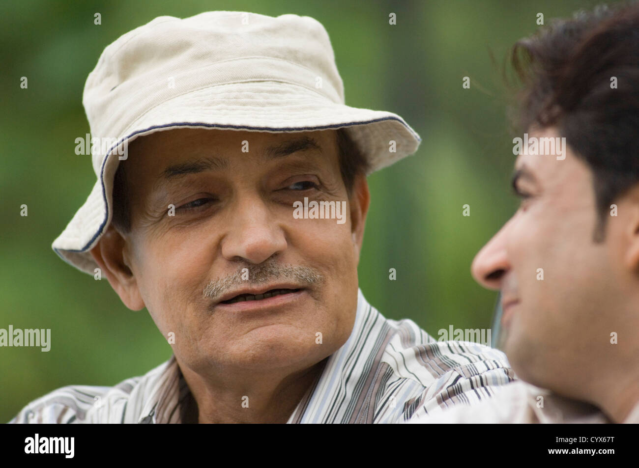 Close-up of a man with his father in a park Stock Photo - Alamy