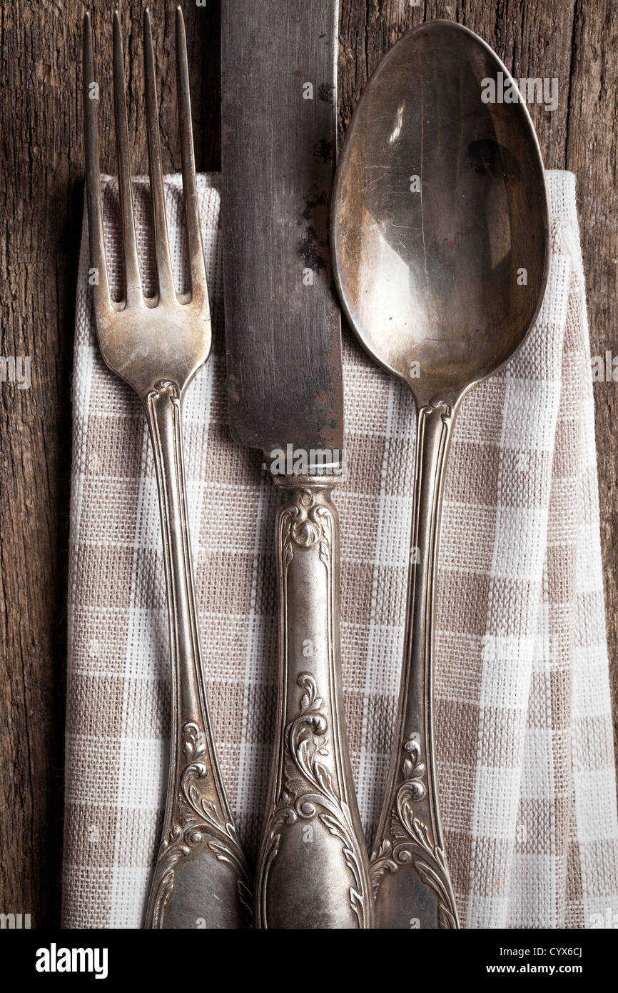 old cutlery on wooden table Stock Photo - Alamy